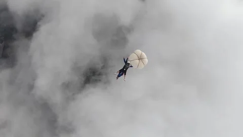 Tandem skydivers free falling through th... | Stock Video | Pond5