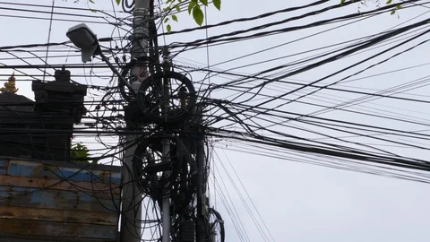 Tangled mess of wires on a telephone pol... | Stock Video | Pond5