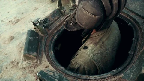 Tank man in military helmet sitting in t... | Stock Video | Pond5