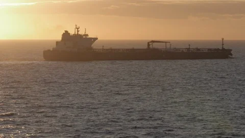 Tanker ship heading at sea in sun back l... | Stock Video | Pond5