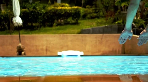 Tanned Muscular Man Jumping into the Poo... | Stock Video | Pond5