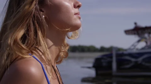 Tanning with wake board boat | Stock Video | Pond5