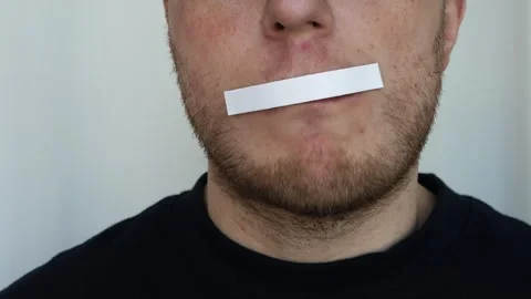 Taped mouth. A man with duct tape on his... | Stock Video | Pond5