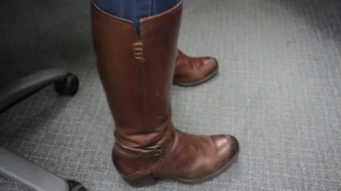 Tapping boots to music | Stock Video | Pond5