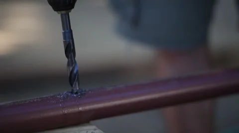 Tapping holes with a drill in steel tubi... | Stock Video | Pond5