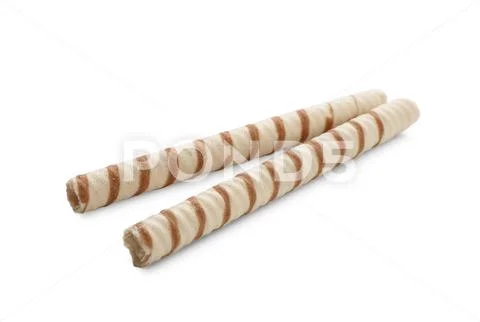 Photograph: Tasty wafer roll sticks on white background. Crispy food ...