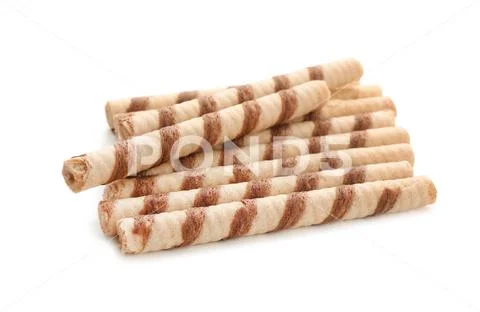 Photograph: Tasty wafer roll sticks on white background. Crispy food ...