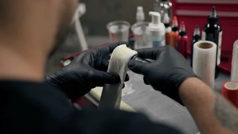 Tattoo artist collects tattoo washing ma... | Stock Video | Pond5