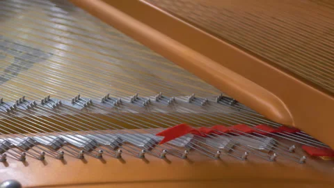 The taut strings inside old grand piano | Stock Video | Pond5