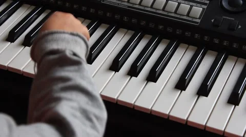 teacher and boy playing the organ | Stock Video | Pond5