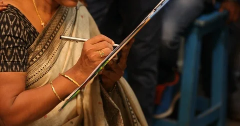 Teacher Checking Attendance Register In ... | Stock Video | Pond5