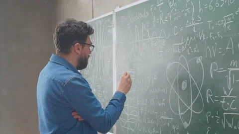 Teacher man writing math formulas on cha... | Stock Video | Pond5