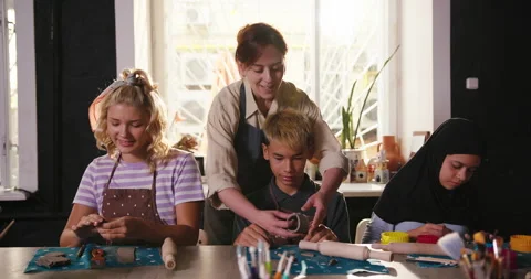 Teacher shows student technique of model... | Stock Video | Pond5