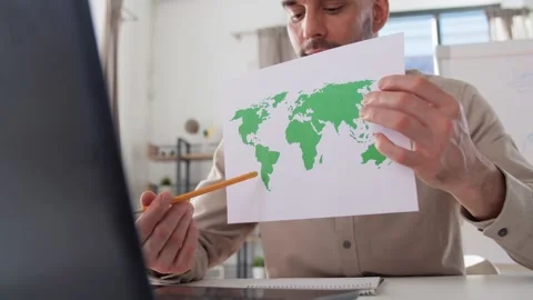 teacher with world map having online cla... | Stock Video | Pond5