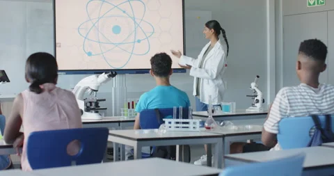 Teaching science, instructor in lab coat... | Stock Video | Pond5