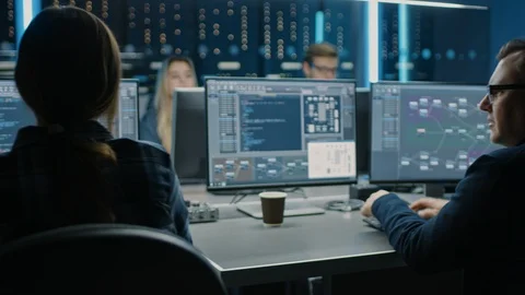 Team of IT Programers Working on Desktop... | Stock Video | Pond5