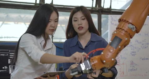 Team of Robotics Engineer Working with R... | Stock Video | Pond5