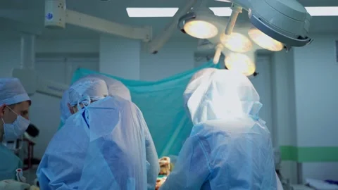 Team of surgeons. Back view of group of ... | Stock Video | Pond5