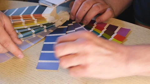 Teamwork. Hands choosing a color palette... | Stock Video | Pond5
