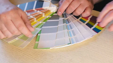 Teamwork. Hands choosing a color palette... | Stock Video | Pond5