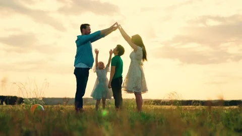 Teamwork happy family shows house with t... | Stock Video | Pond5