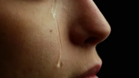 A Tear Running Down a Young Beautiful Wo... | Stock Video | Pond5