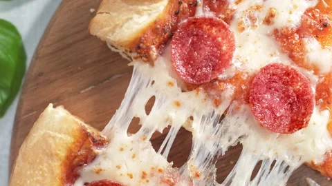 Tearing Slice of Pepperoni Pizza - Table... | Stock Video | Pond5