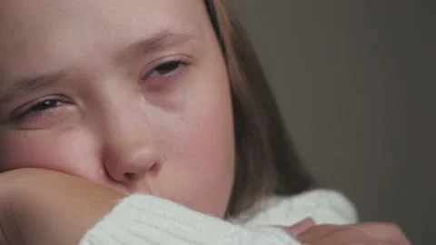 Tears roll down the cheeks on the child'... | Stock Video | Pond5