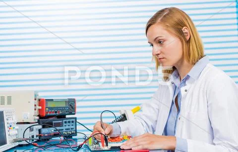 Tech Tests Electronic Equipment In Service Centre - Stock Image ...