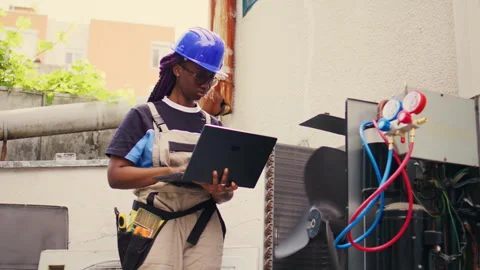 Technician working on HVAC system | Stock Video | Pond5