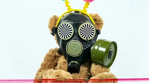 Teddy bear wearing gas mask with hypnoti... | Stock Video | Pond5