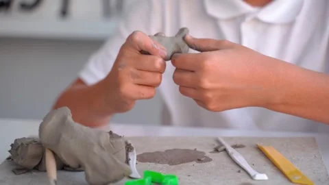Teen Boy At Art School Clay Sculpt in Ar... | Stock Video | Pond5