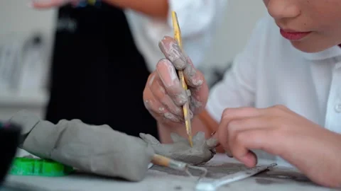 Teen Boy At Art School Clay Sculpt in Ar... | Stock Video | Pond5