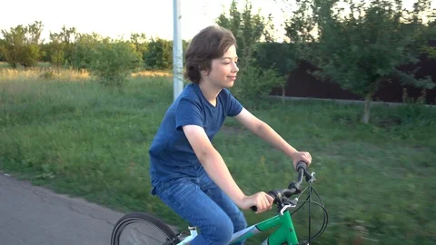 Teen Boy Bike Stock Footage ~ Royalty Free Stock Videos | Pond5