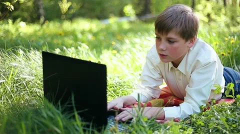 Teen boy child with a PC laptop, communi... | Stock Video | Pond5