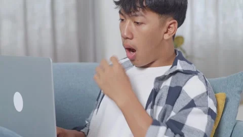 Teen Boy Eating Snacks And Typing On A L... | Stock Video | Pond5