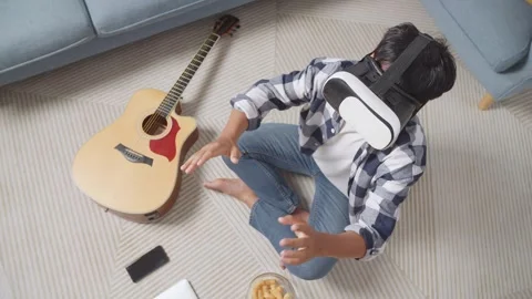 Teen Boy Sitting On Carpet On The Floor ... | Stock Video | Pond5