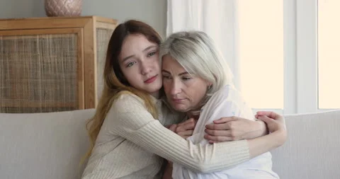 Teen daughter cuddle sad mother, consoli... | Stock Video | Pond5
