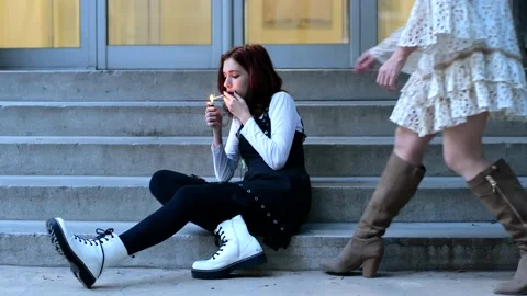 Teen daughter smoking cigarette near her... | Stock Video | Pond5