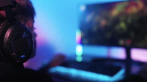 Teen gamer playing strategy video game a... | Stock Video | Pond5