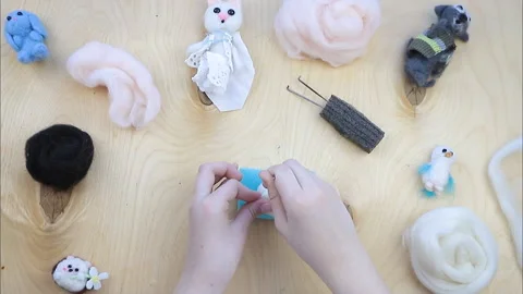teen girl engaged in felting wool making... | Stock Video | Pond5