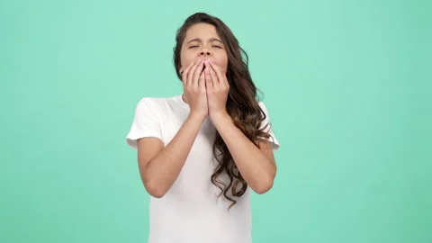 teen girl long curly hair sneezing with ... | Stock Video | Pond5
