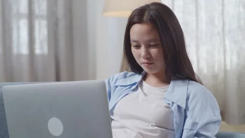 Teen Girl With Snacks Typing On A Laptop... | Stock Video | Pond5