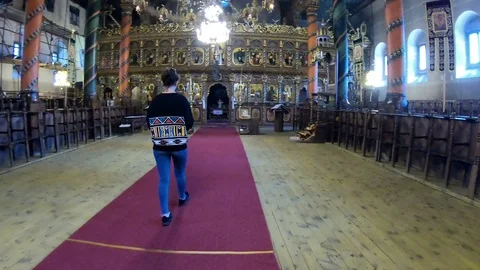 teen girl walk inside orhodox church alt... | Stock Video | Pond5