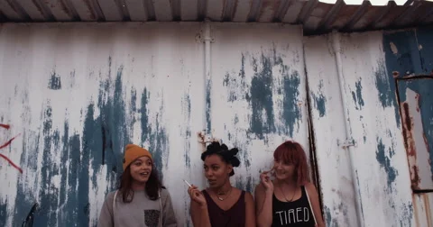 Teen grunge girl smoking and talking wit... | Stock Video | Pond5