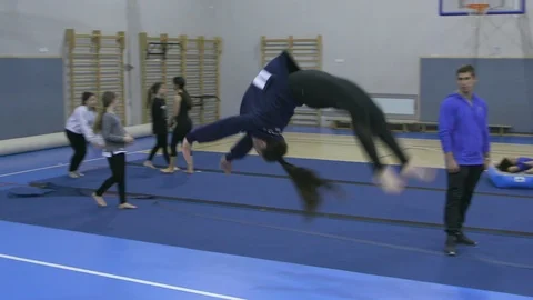 Teen gymnastics pro exercise sequence tr... | Stock Video | Pond5