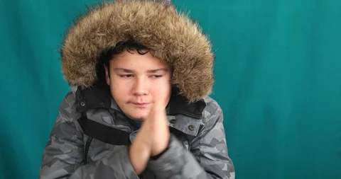 Teenage boy chilling at green screen bac... | Stock Video | Pond5