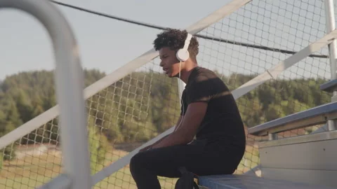 Teenage Boy with Curly Hair Sings Along ... | Stock Video | Pond5