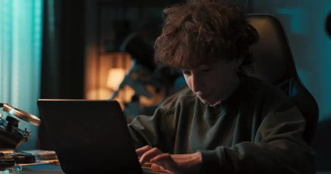 Teenage boy doing homework using compute... | Stock Video | Pond5