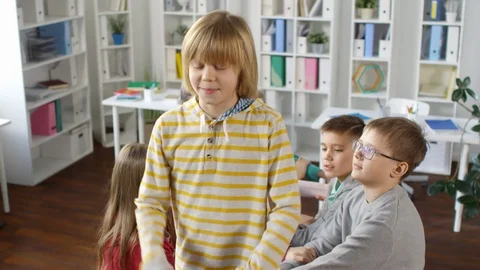 Teenage Boy Falling Backwards into Frien... | Stock Video | Pond5